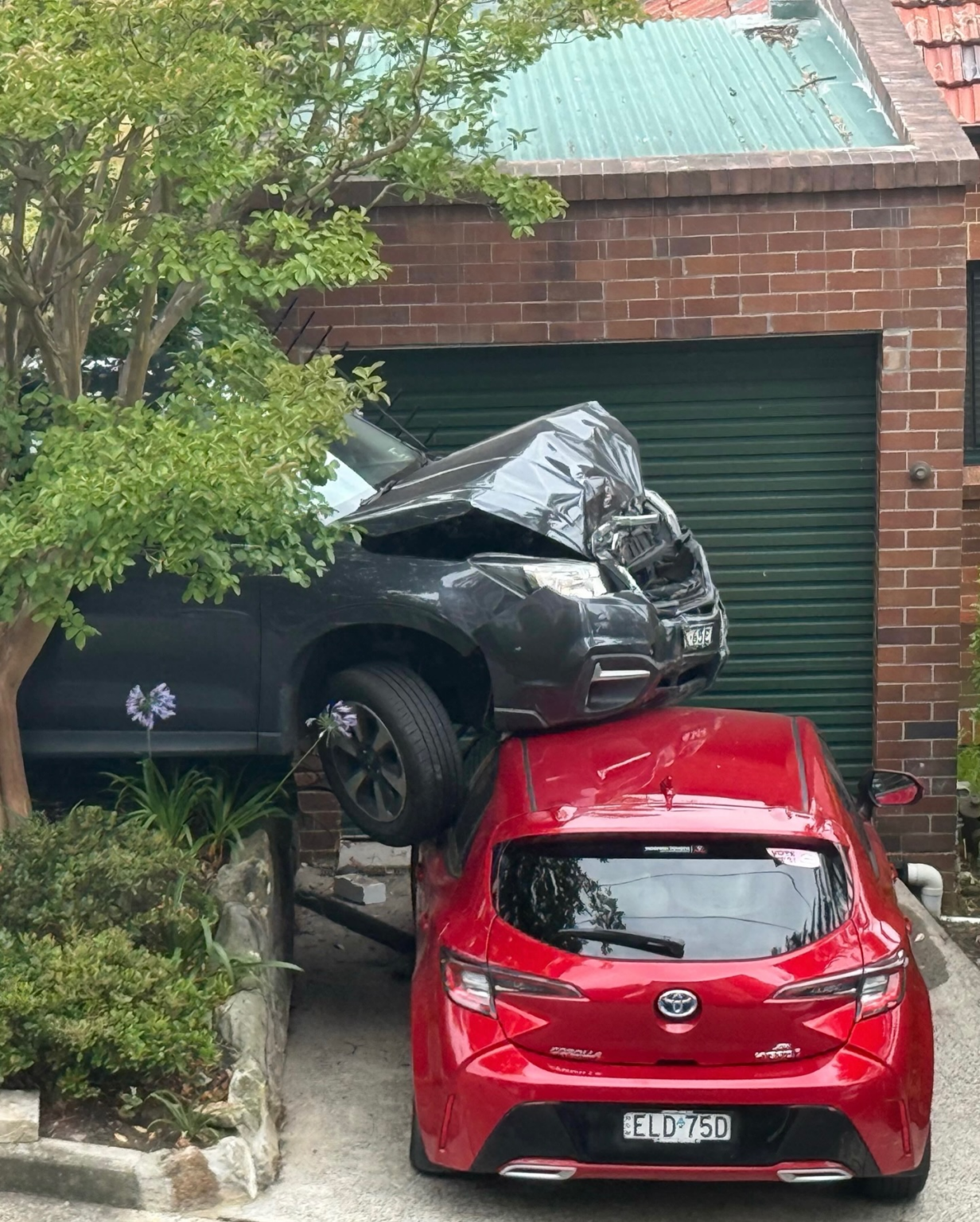 A freak accident has everyone asking: How did this car get up there ...