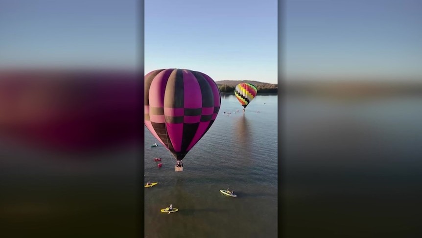 Videos capture moment hot air balloon knocks kayakers into lake during ...